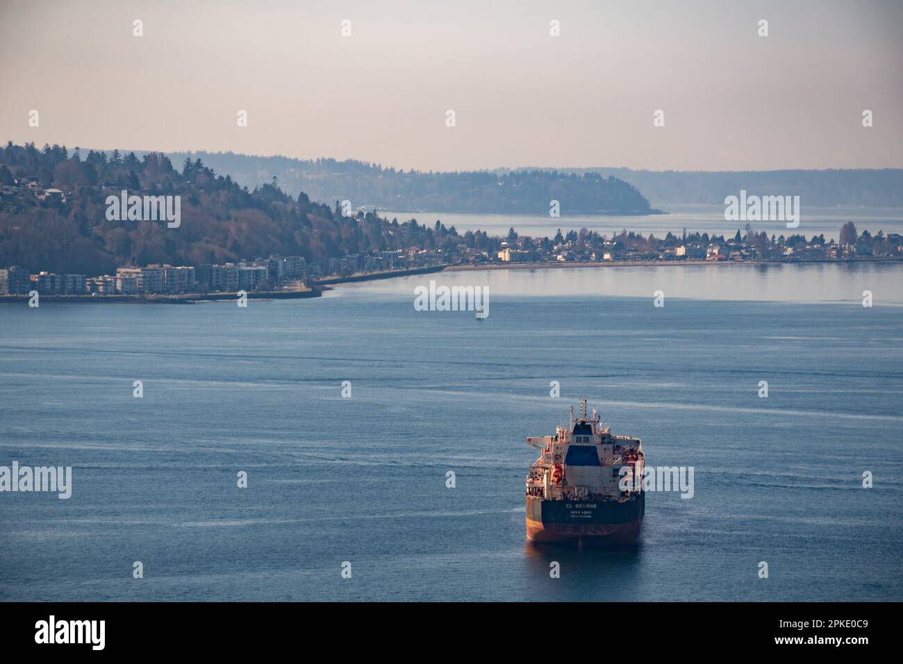 A cargo ship leaves the harbour at Seattle in the Pacific North West ...
