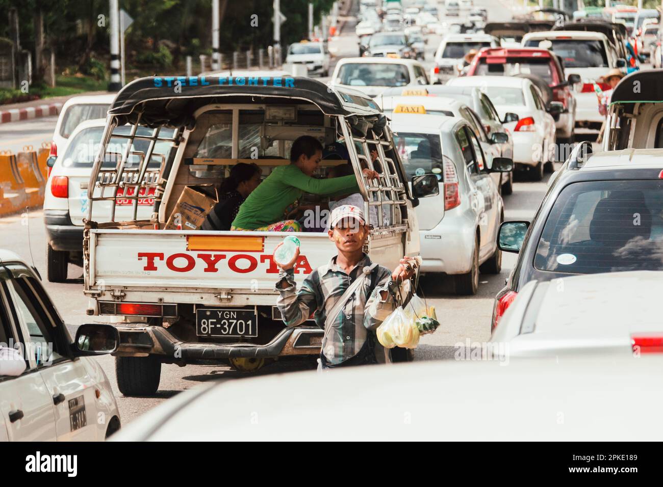 Yangon, Myanmar - March 25, 2023 : Myanmar man walking down on the ...