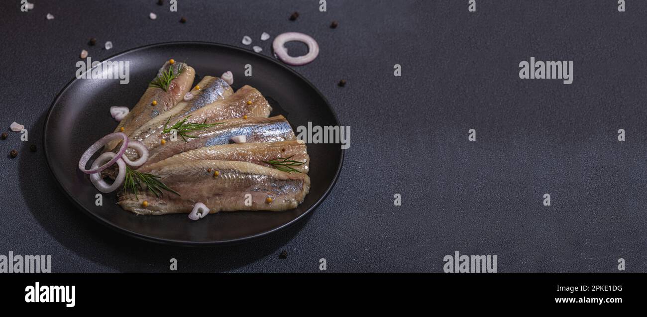 Fillet of pickled marinated sea herring fish with shallots and dill ...
