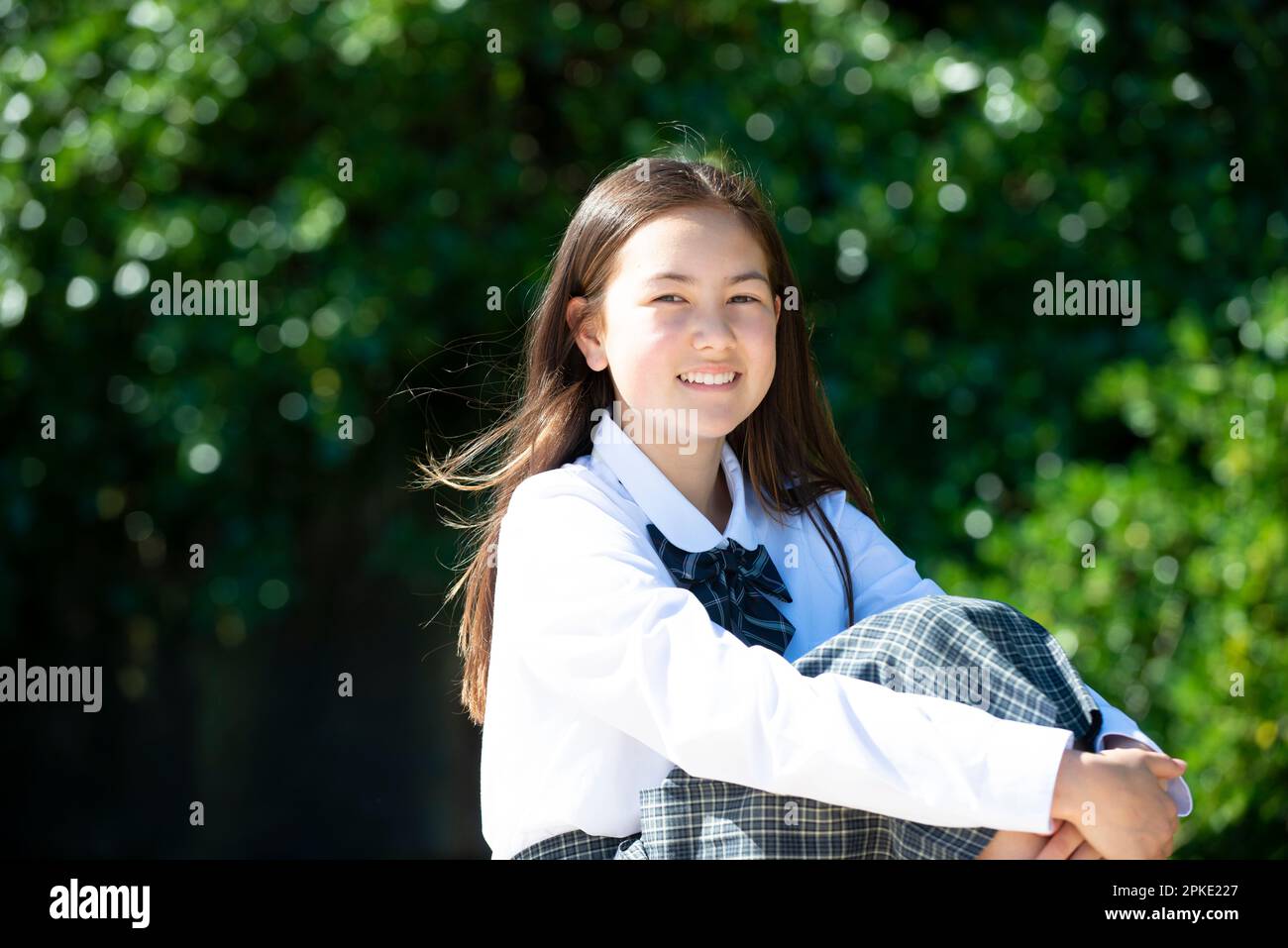 Female student in uniform smiling Stock Photo - Alamy