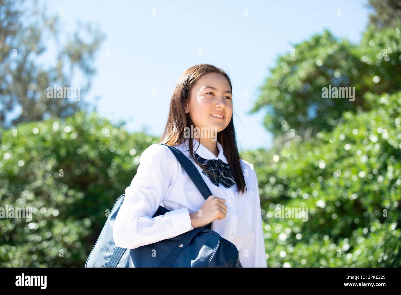 Female student in uniform smiling Stock Photo - Alamy