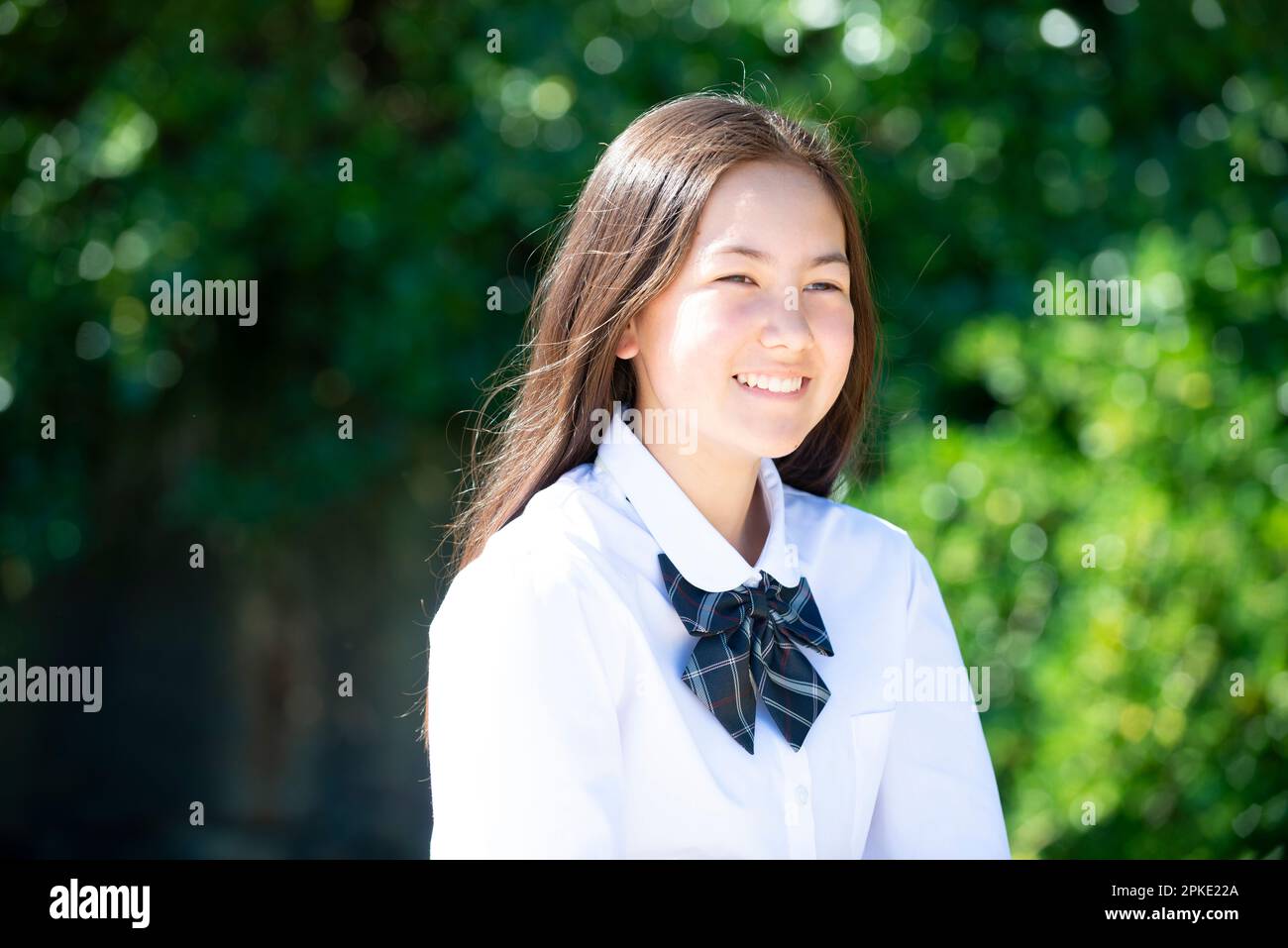 Female student in uniform smiling Stock Photo - Alamy