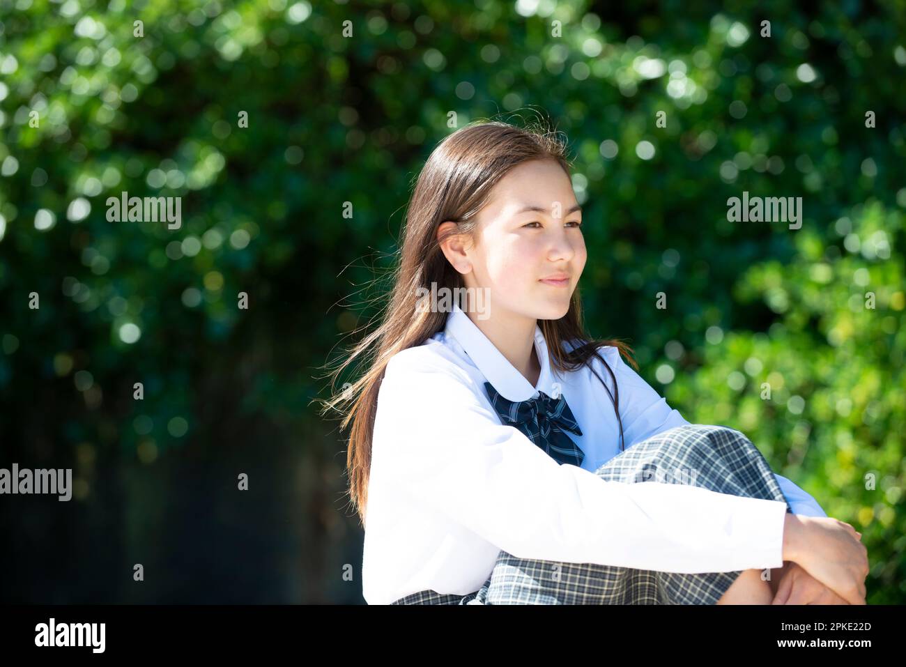 Female student in uniform smiling Stock Photo - Alamy