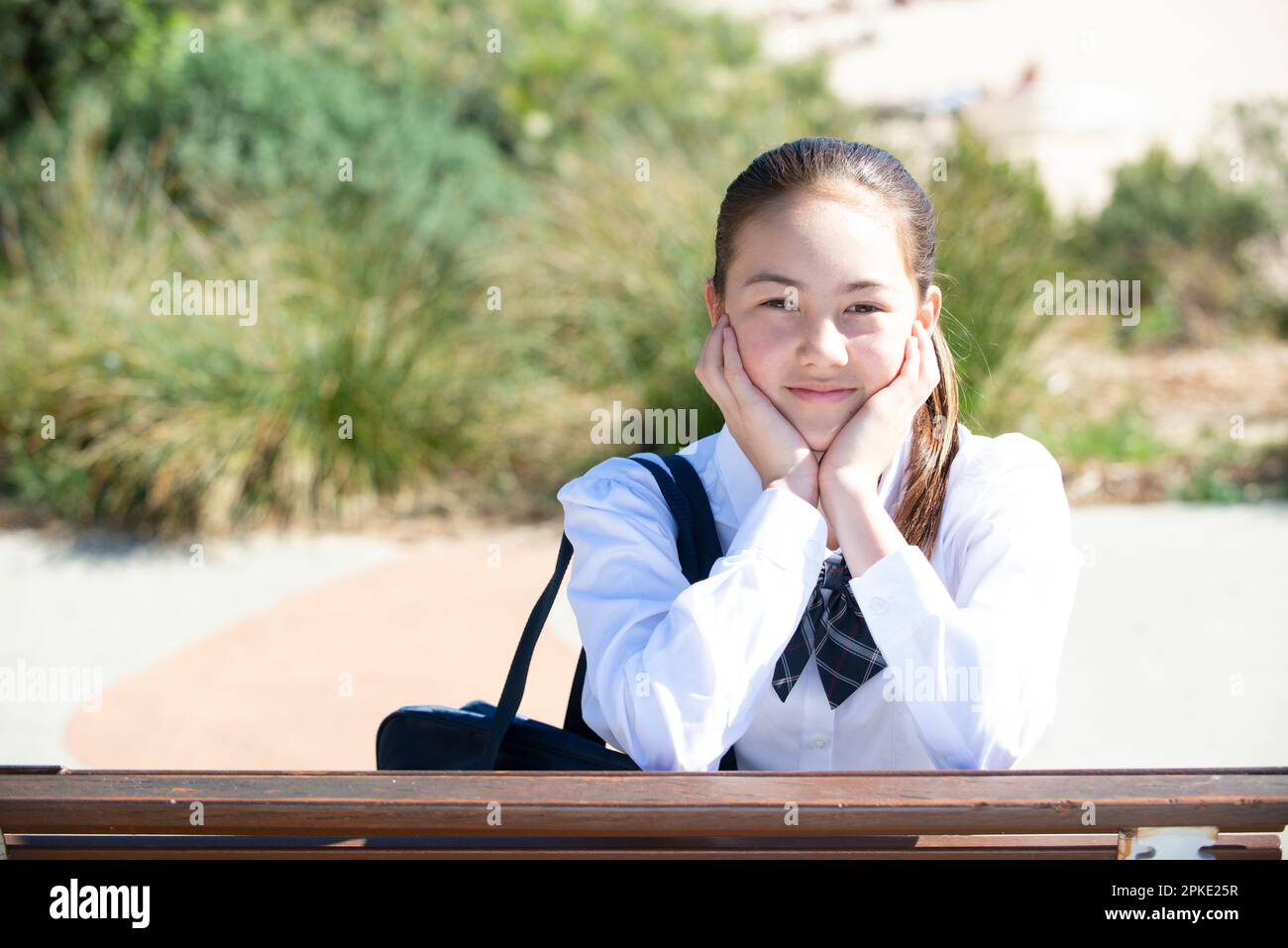 Female student in school uniform with cheekbones Stock Photo - Alamy