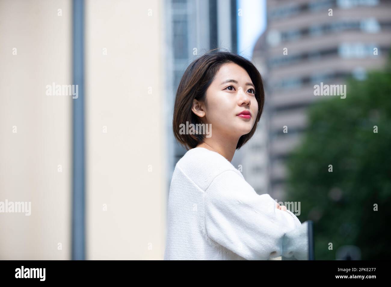 Woman looking into the distance Stock Photo - Alamy