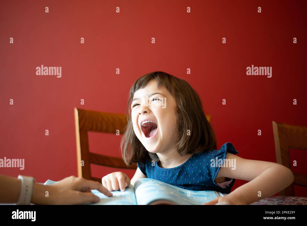 Girl laughing hard Stock Photo - Alamy
