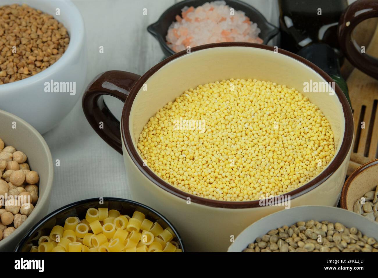 Millet in bowl. Shopping and storage products. Vegetarian organic ...
