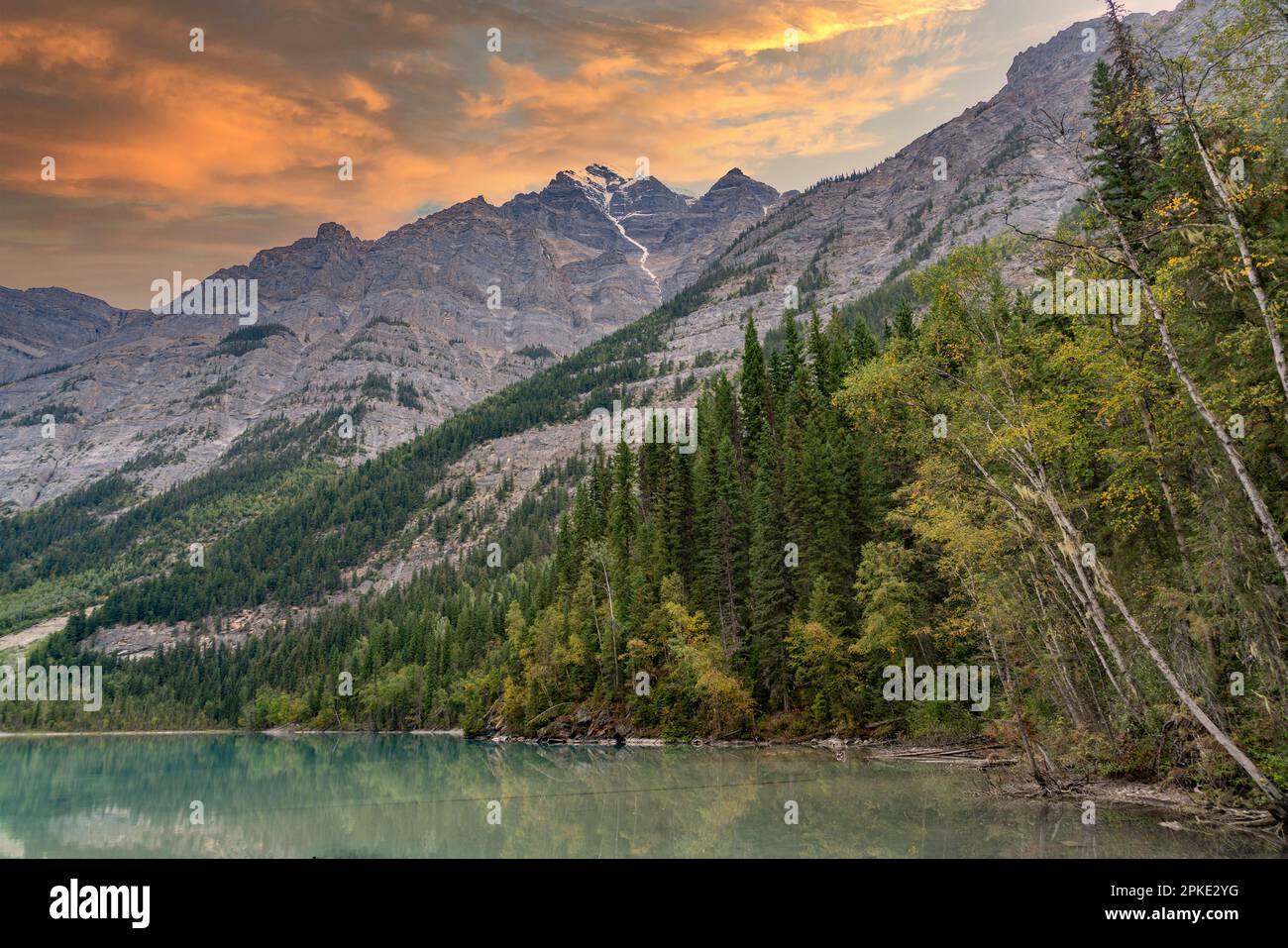 A stunning sunset illuminates the snow-capped peaks of Robson Mountain ...