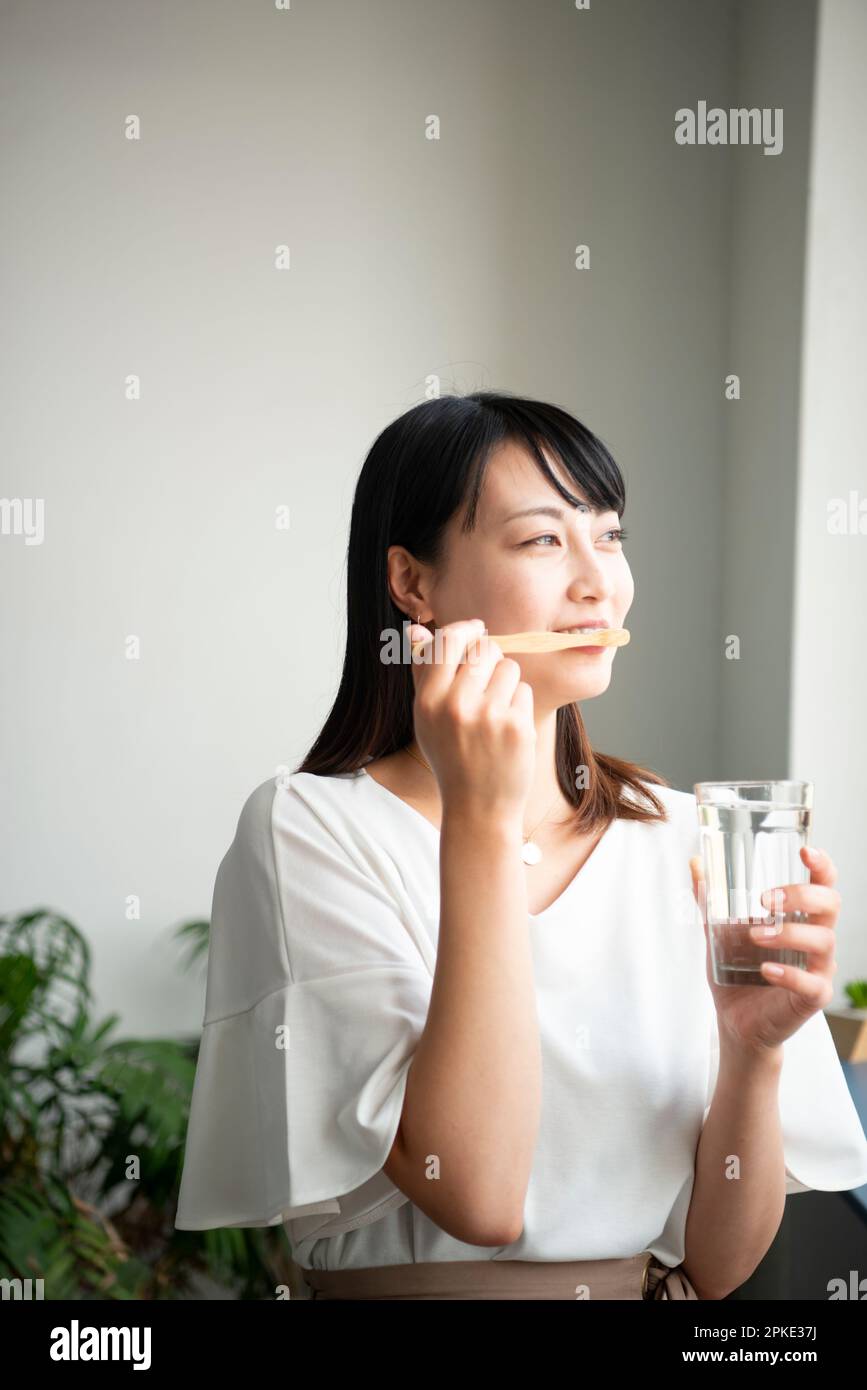Woman brushing her teeth Stock Photo - Alamy
