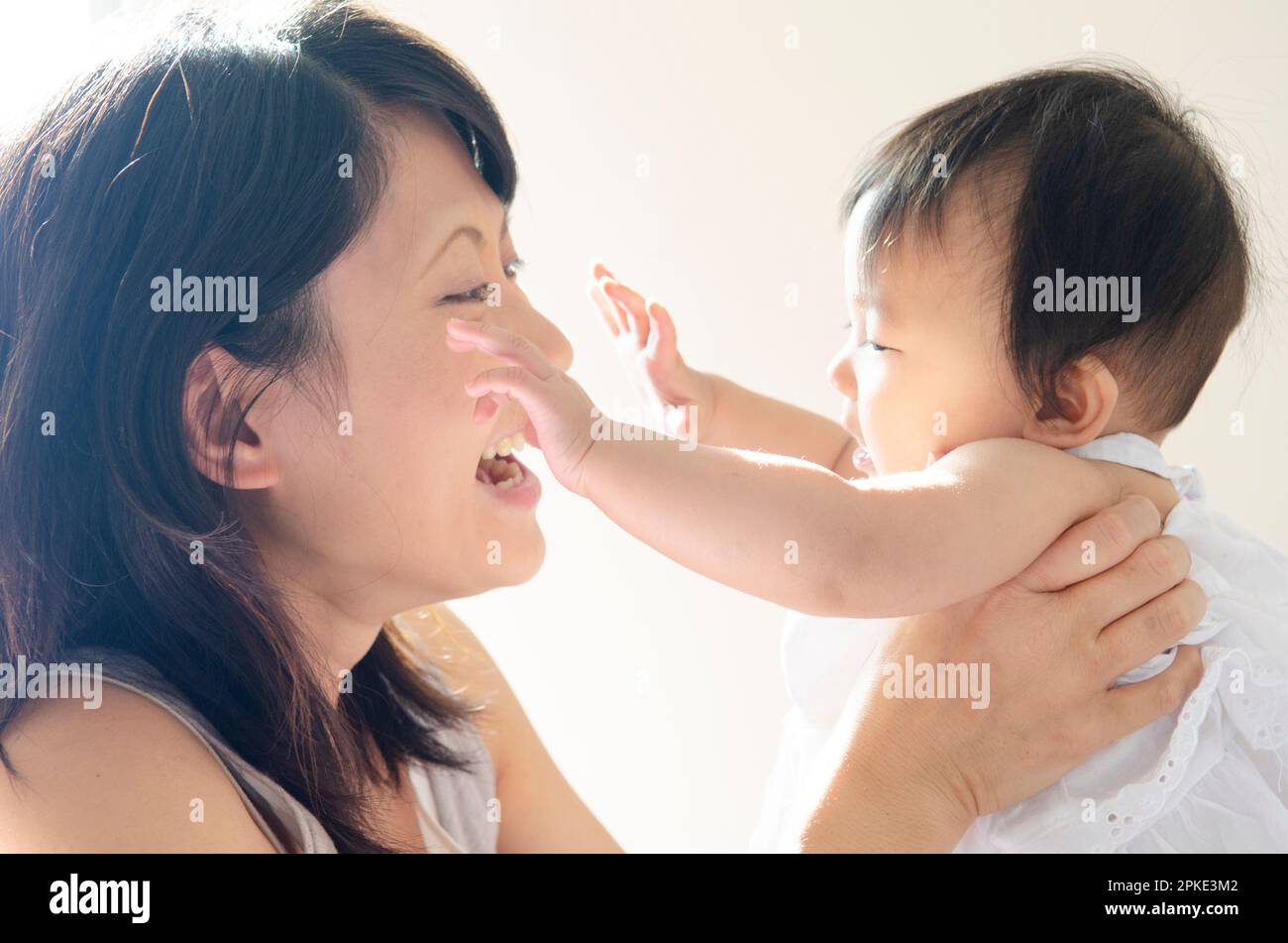 Mother nursing her baby Stock Photo - Alamy
