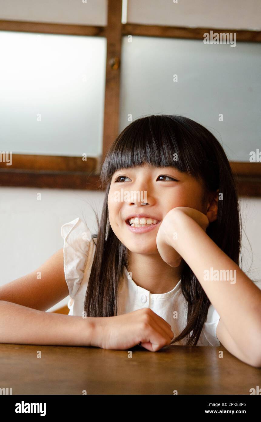 Girl smiling with cheekbones Stock Photo - Alamy