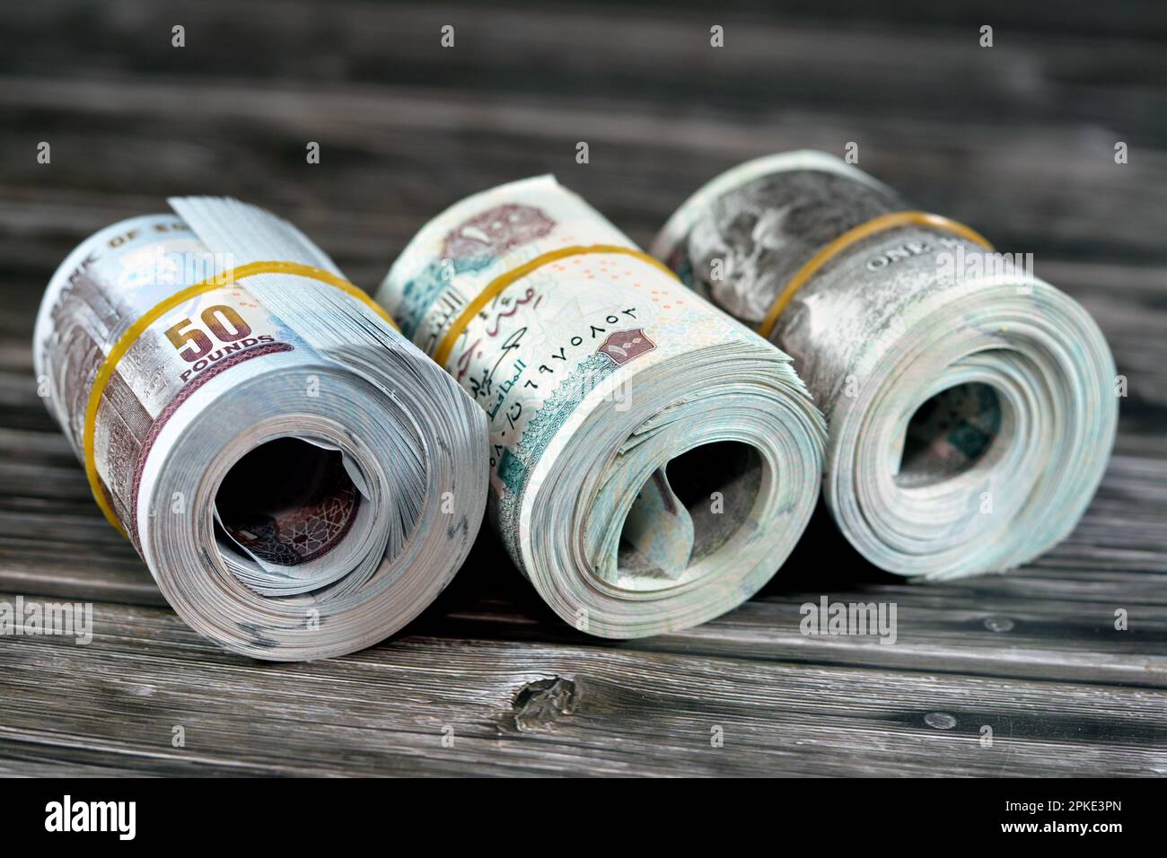 Rolls of Egypt money banknote bills of 100 and 50 EGP LE one hundred ...