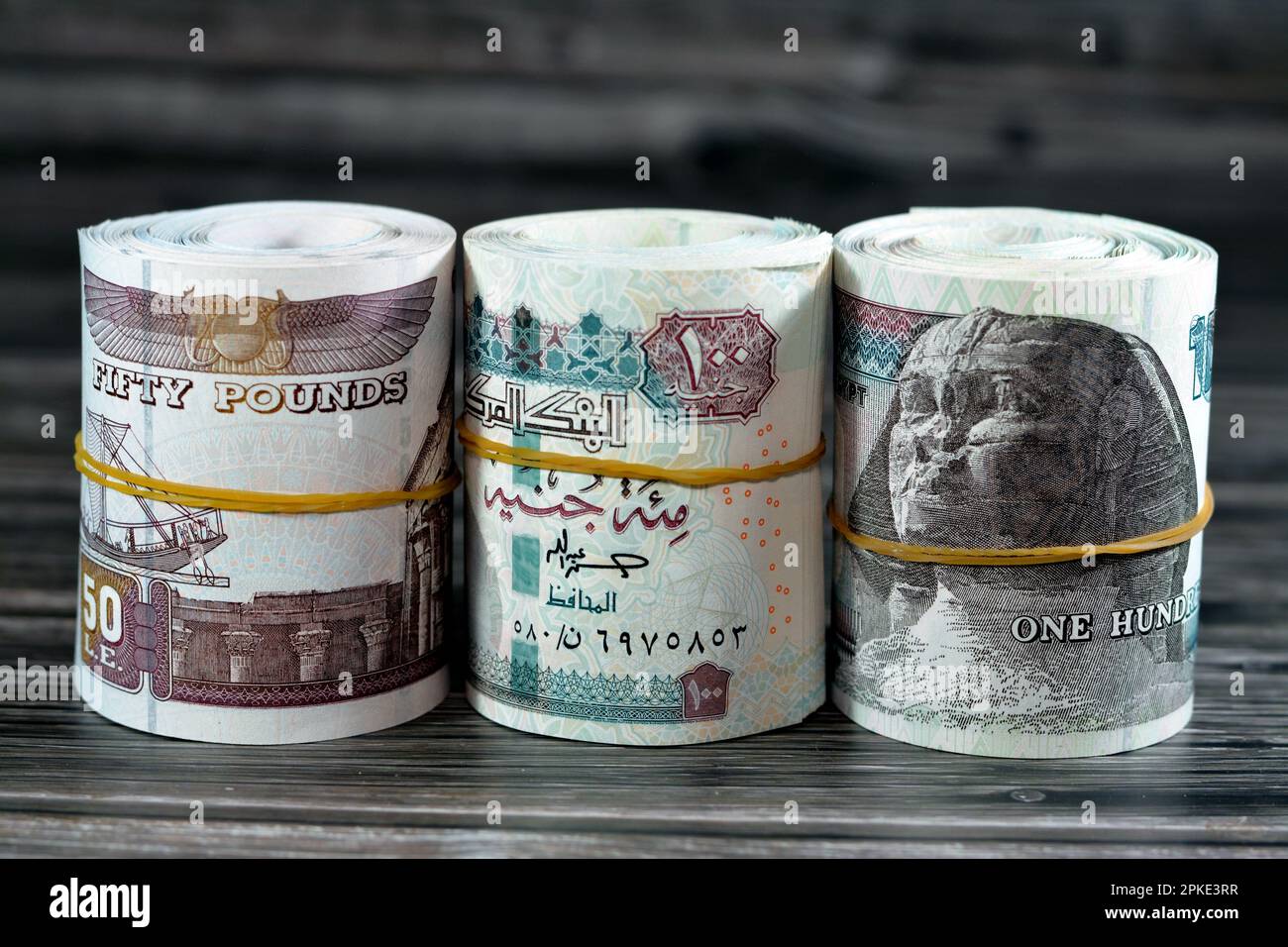 Rolls of Egypt money banknote bills of 100 and 50 EGP LE one hundred ...