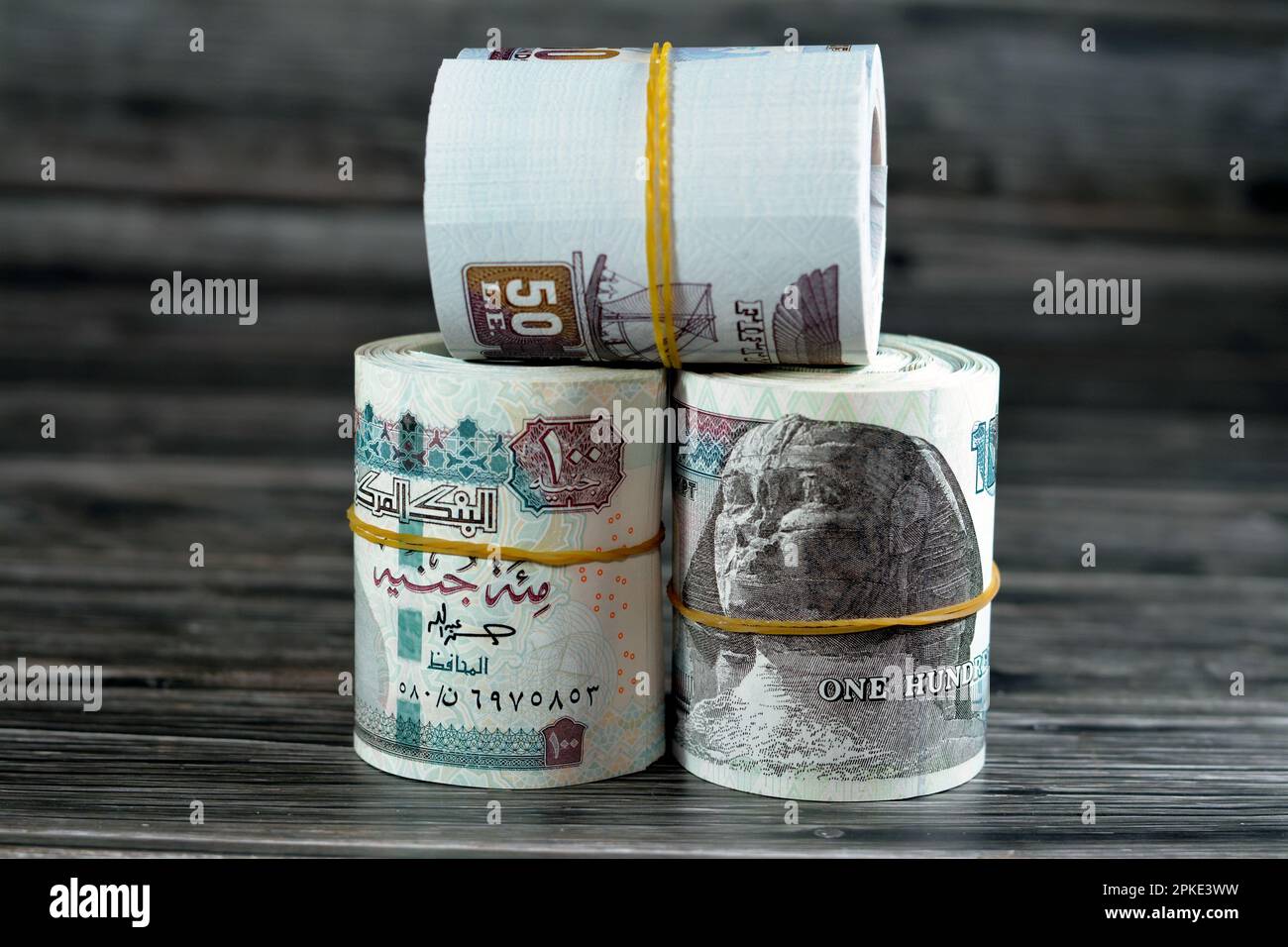Rolls of Egypt money banknote bills of 100 and 50 EGP LE one hundred ...