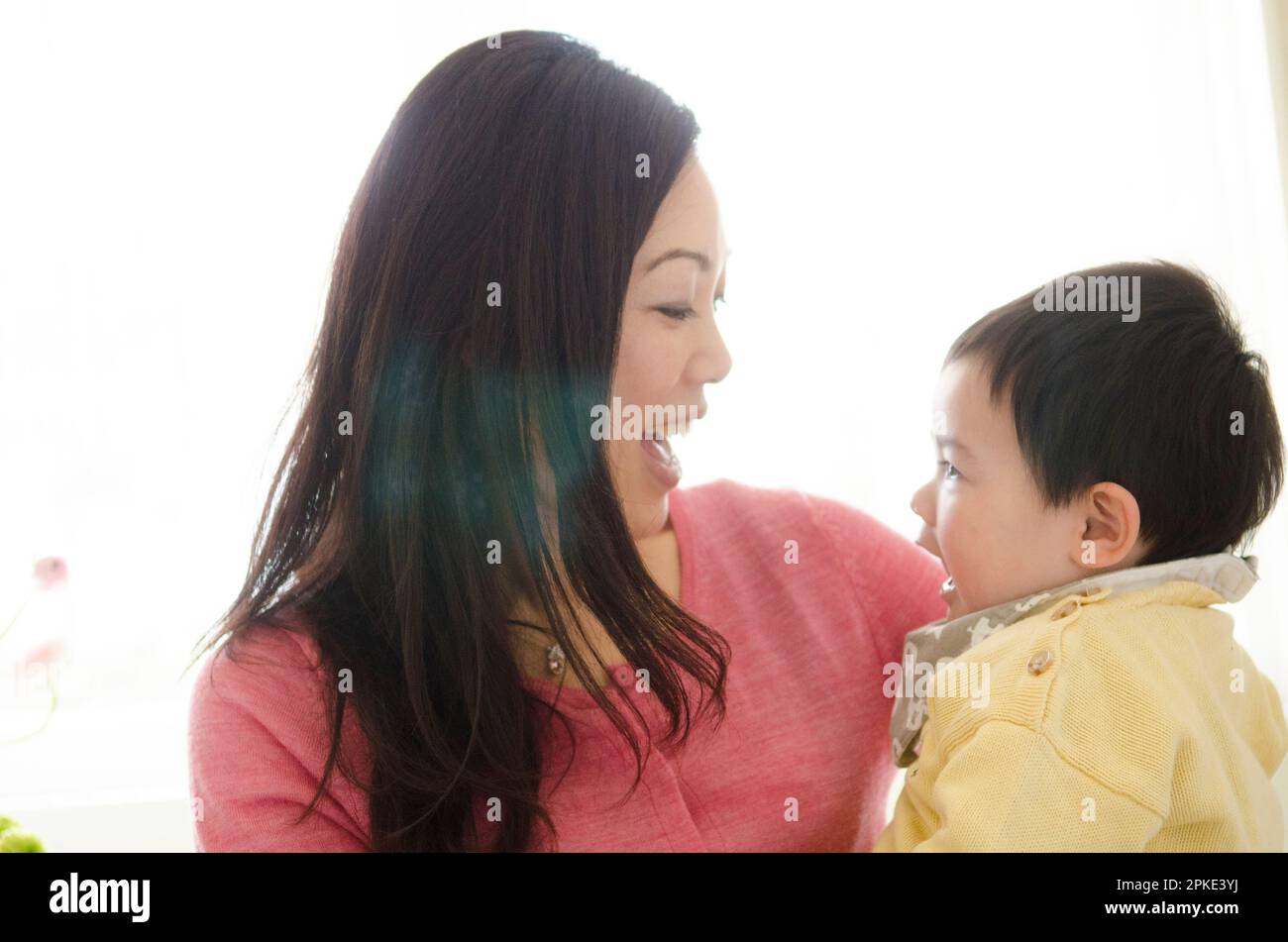 Parent and child laughing with each other Stock Photo - Alamy