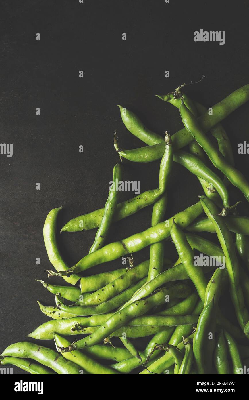 Fresh green faba beans on black rustic background, table top shot Stock ...
