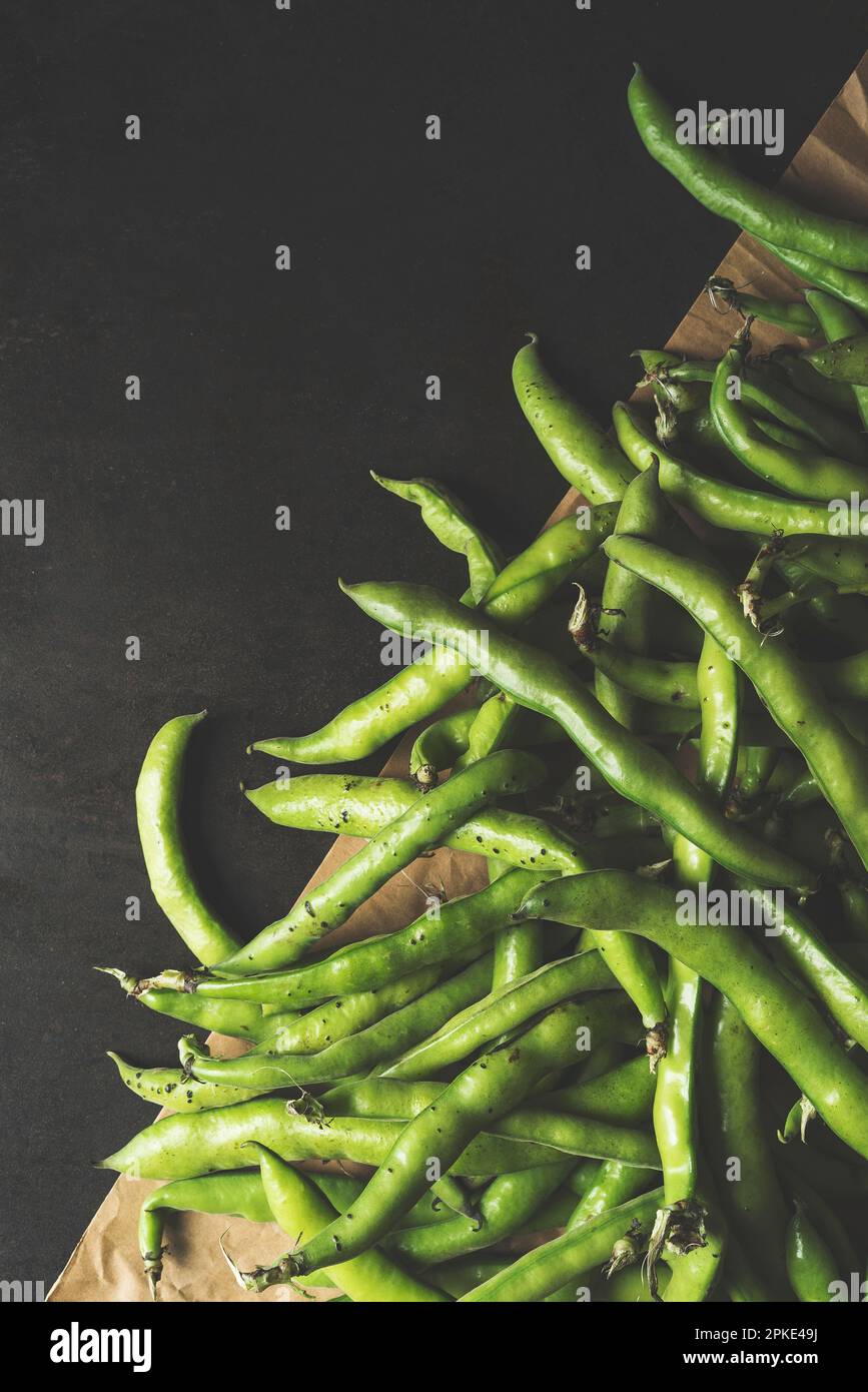 Fresh green faba beans on black rustic background, table top shot Stock ...