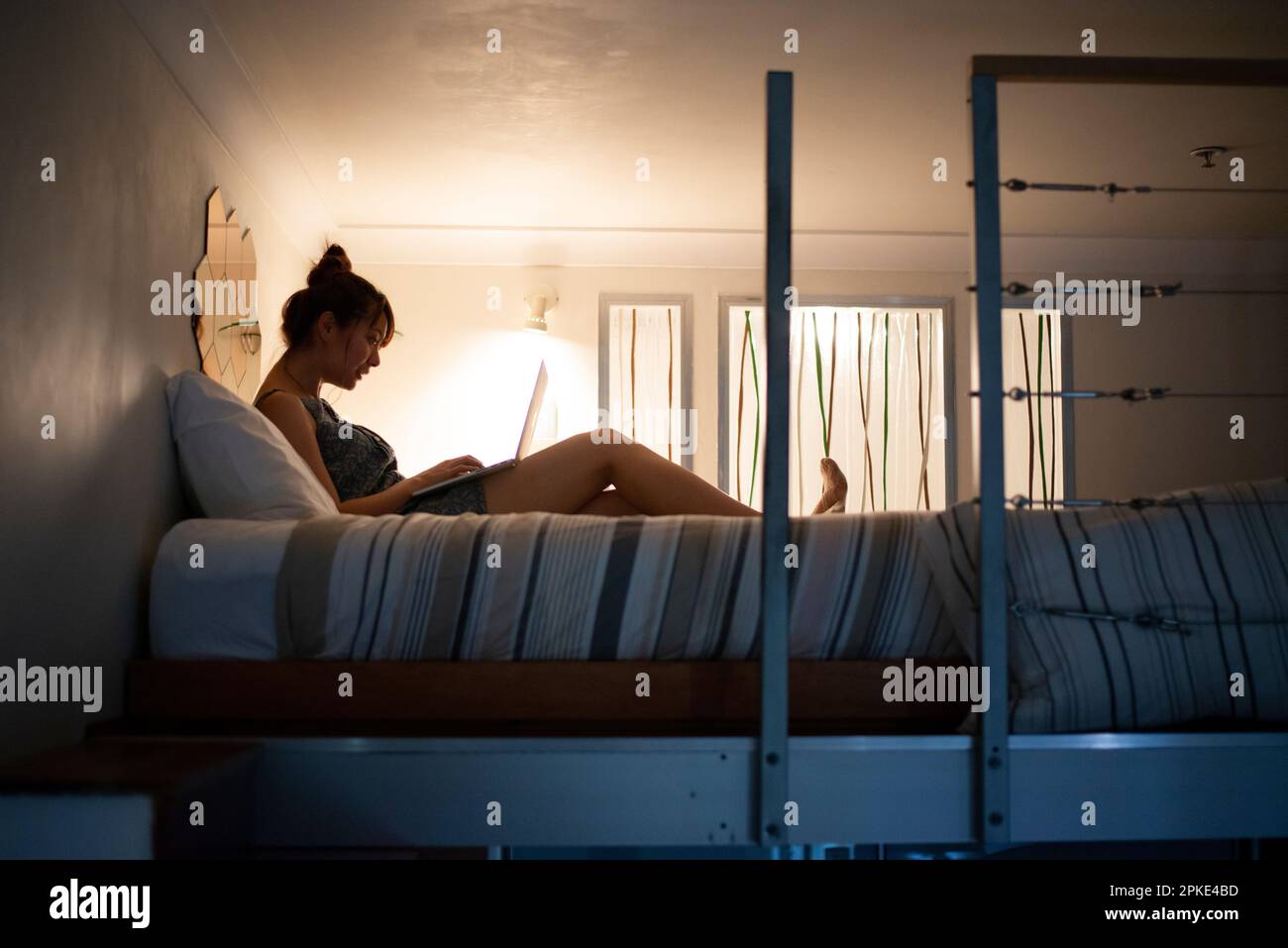 Working at laptop in bed at night hi-res stock photography and images ...