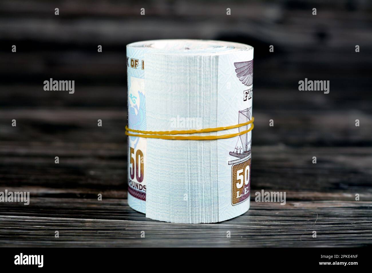 50 EGP LE fifty Egyptian pounds cash money bills rolled up with rubber ...