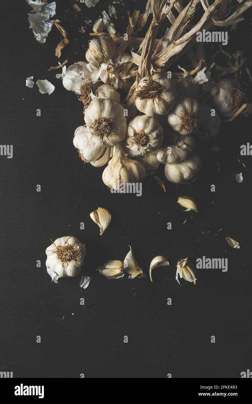 Garlic bulbs on black rustic metal background, table top shot Stock ...