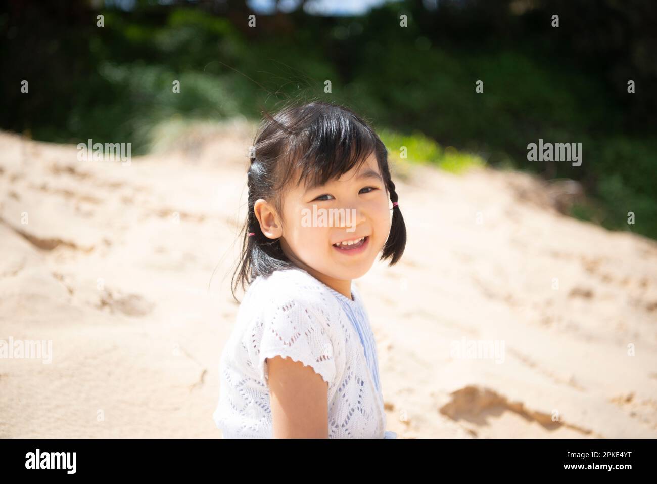 Girl Laughing on the Beach Stock Photo - Alamy