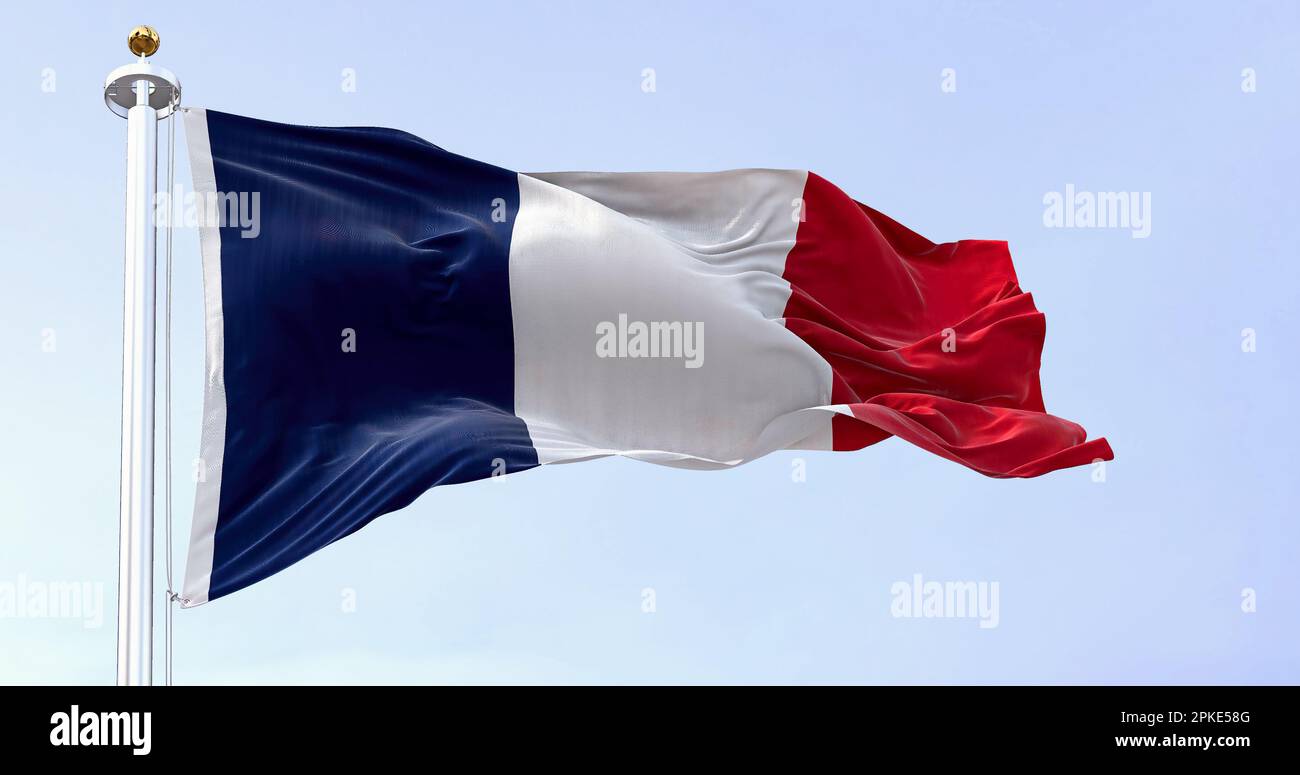 The national flag of France waving in the wind on a clear day. Tricolor ...