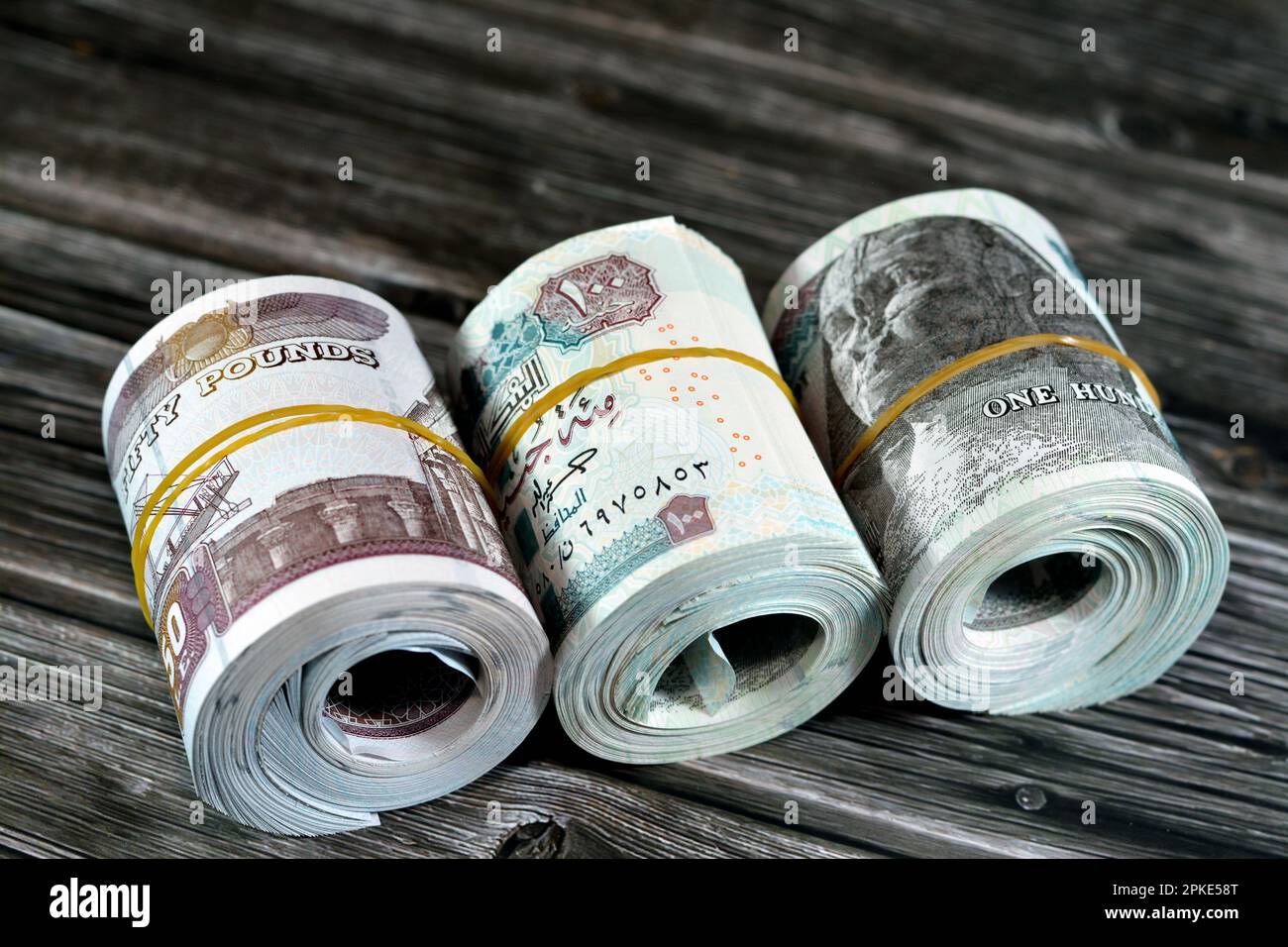 Rolls of Egypt money banknote bills of 100 and 50 EGP LE one hundred ...