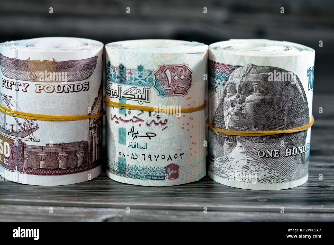 Rolls of Egypt money banknote bills of 100 and 50 EGP LE one hundred ...