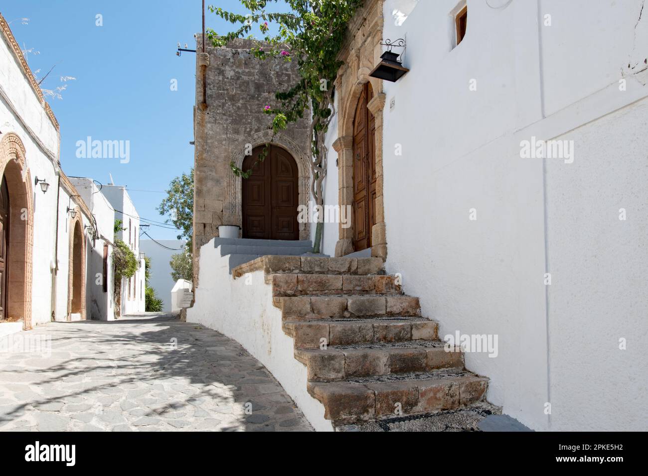 Beautiful Greek Street with summer flowers in Lindos village Stock ...