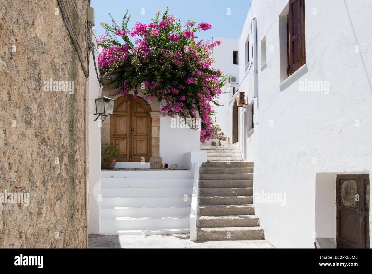 Beautiful Greek Street with summer flowers in Lindos village Stock ...