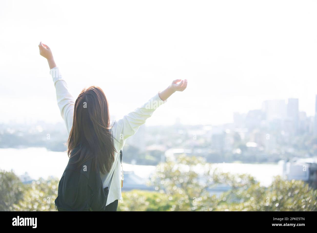 Back view of woman stretching Stock Photo - Alamy