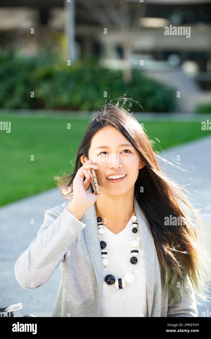 Making phone call outdoors woman hi-res stock photography and images ...