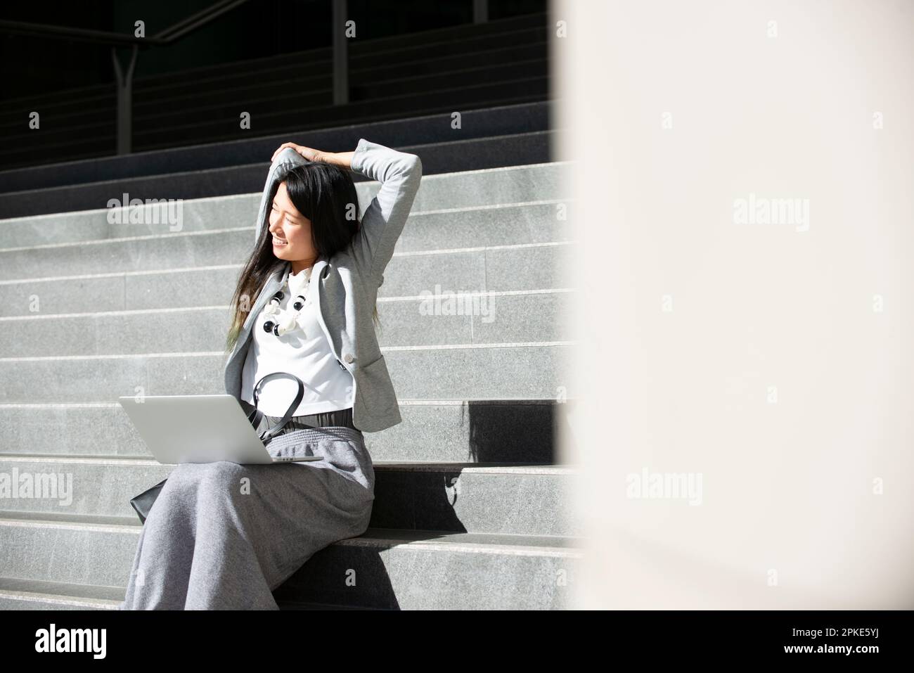 Sitting stairs laptop hi-res stock photography and images - Alamy