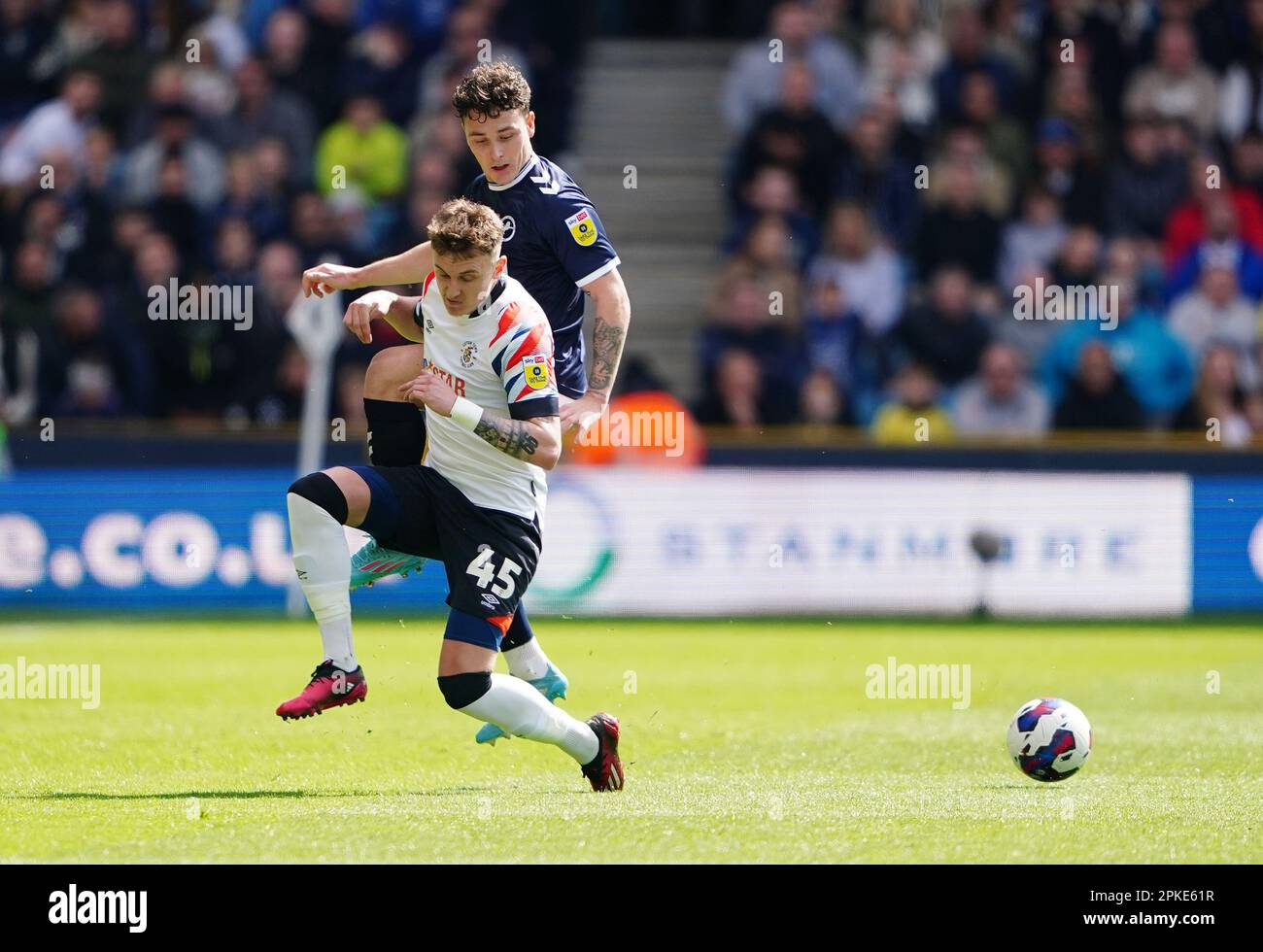 Millwall's Danny McNamara and Luton Town's Alfie Doughty (front) battle ...