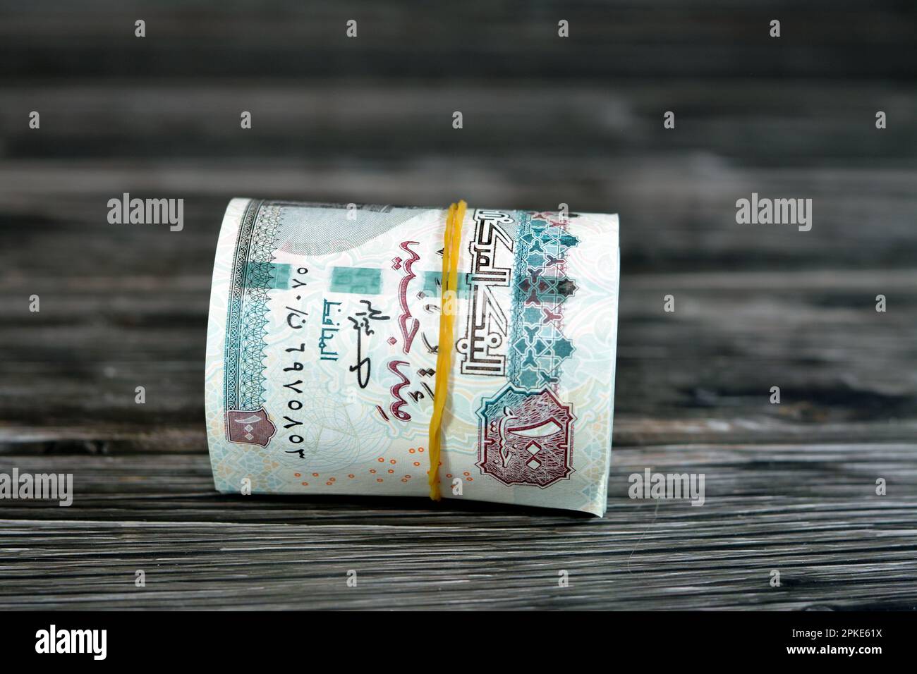 100 EGP LE one hundred Egyptian pounds cash money bills rolled up with ...