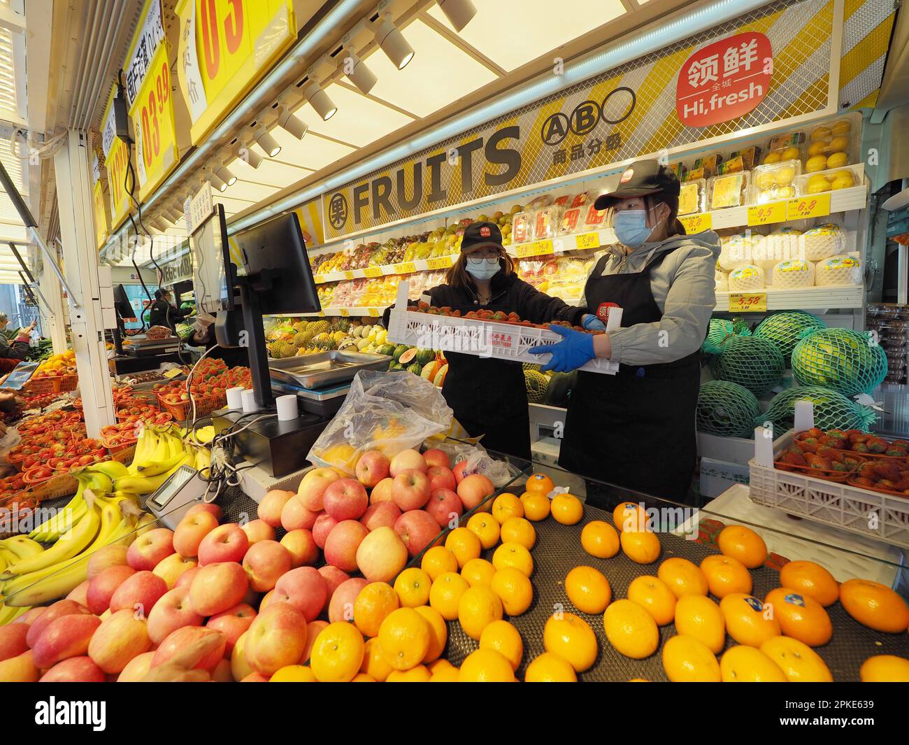 BEIJING, CHINA - APRIL 7, 2023 - People buy fruits and vegetables at a ...