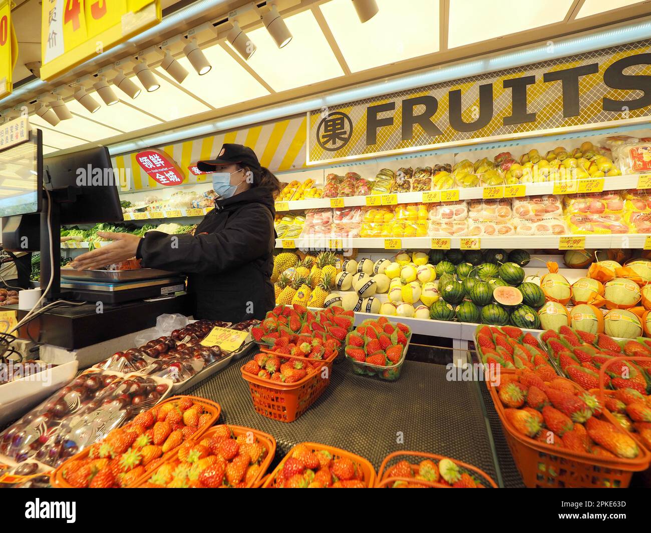 BEIJING, CHINA - APRIL 7, 2023 - People buy fruits and vegetables at a ...