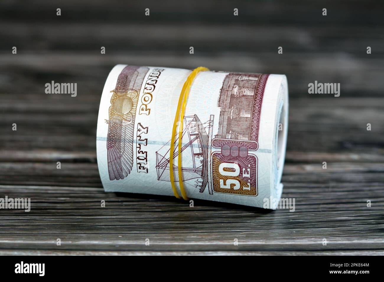 50 EGP LE fifty Egyptian pounds cash money bills rolled up with rubber ...