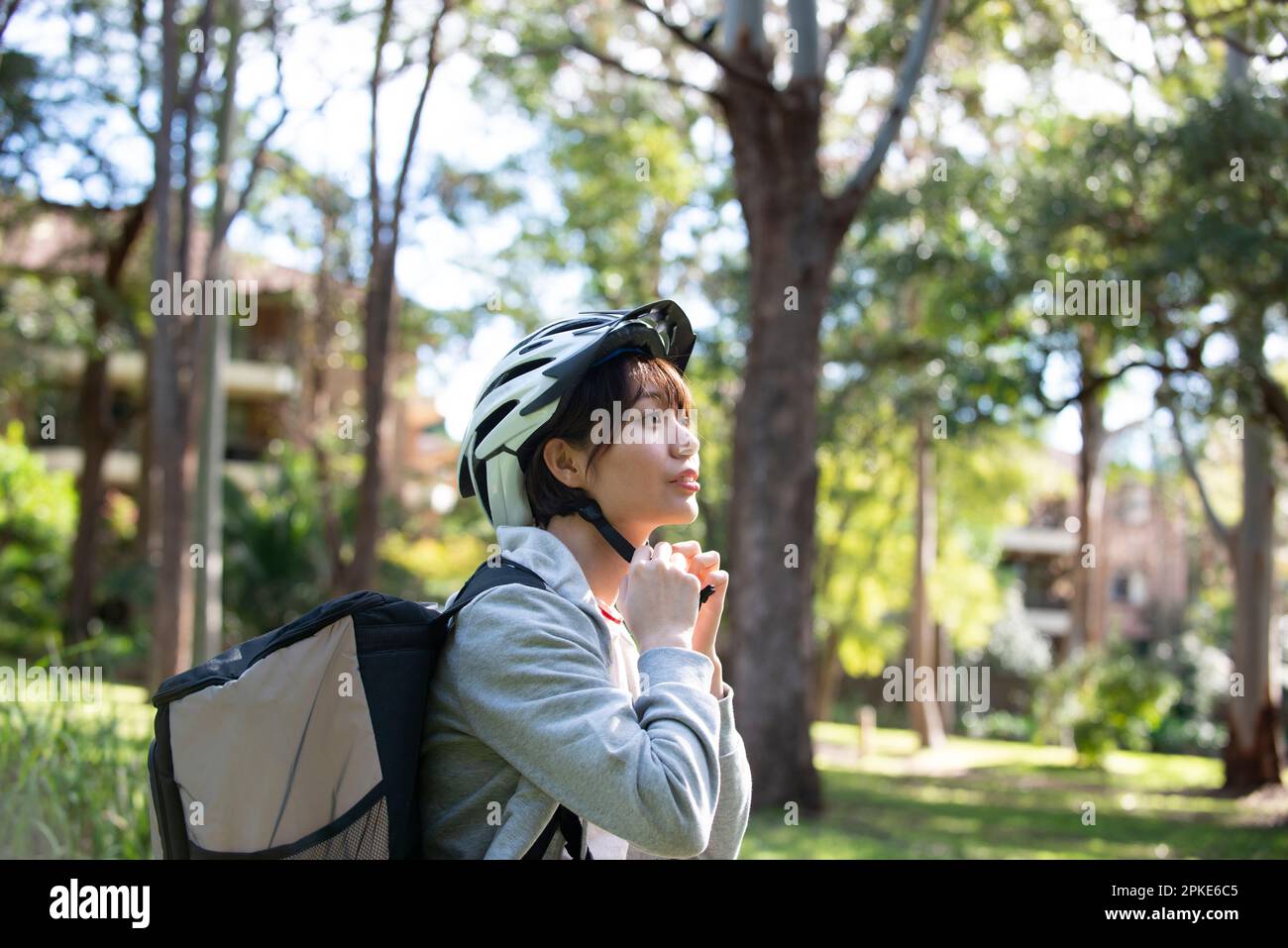 Food delivery delivery man woman with helmet Stock Photo - Alamy