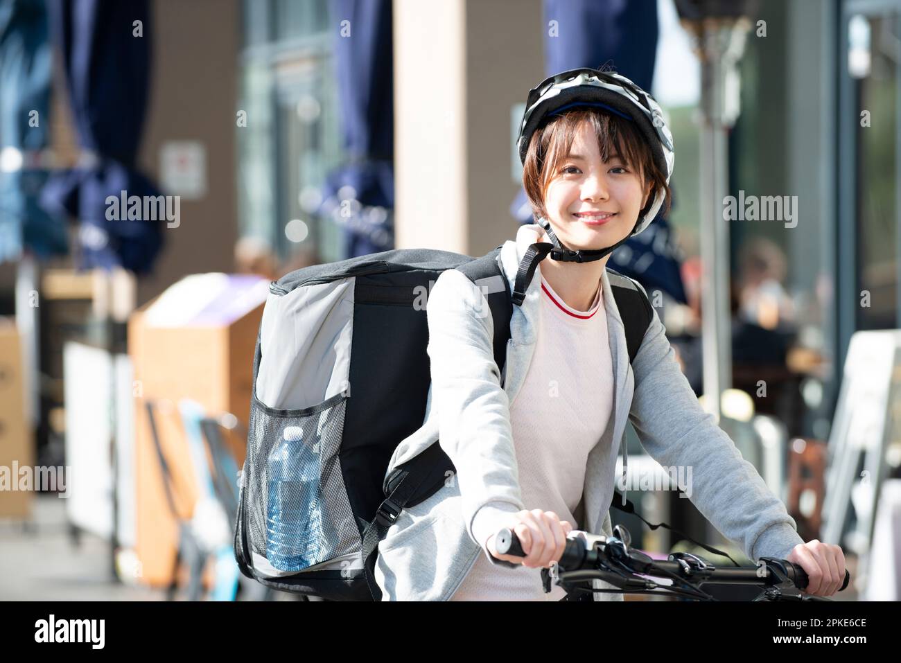 Asian woman on bike hi-res stock photography and images - Alamy