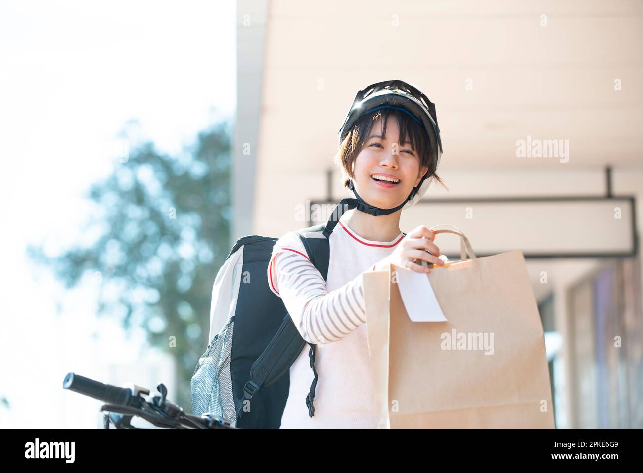 Woman holding work bag hi-res stock photography and images - Alamy