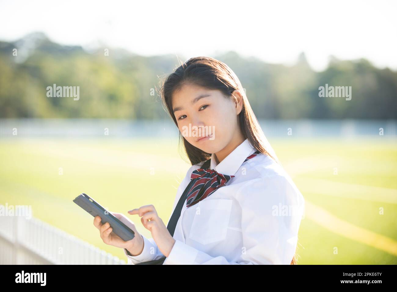 Asian girl cell phone camera school hi-res stock photography and images ...