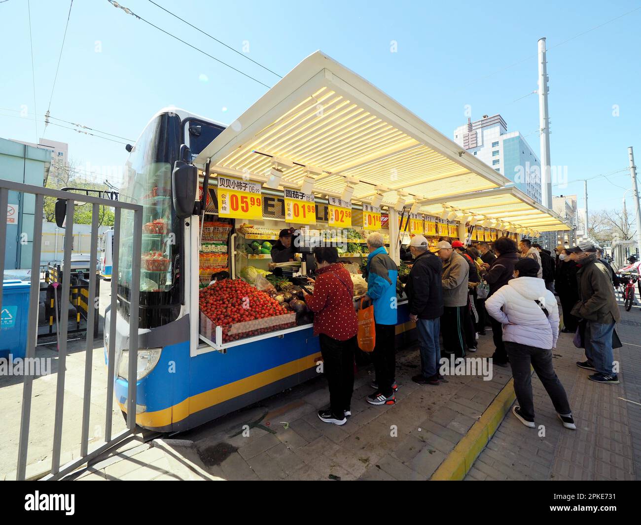 BEIJING, CHINA - APRIL 7, 2023 - People buy fruits and vegetables at a ...