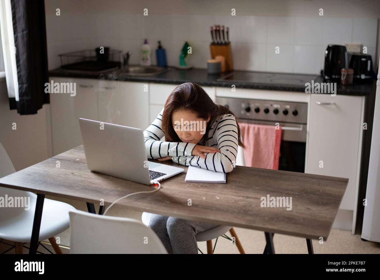 Woman depressed in front of computer Stock Photo - Alamy