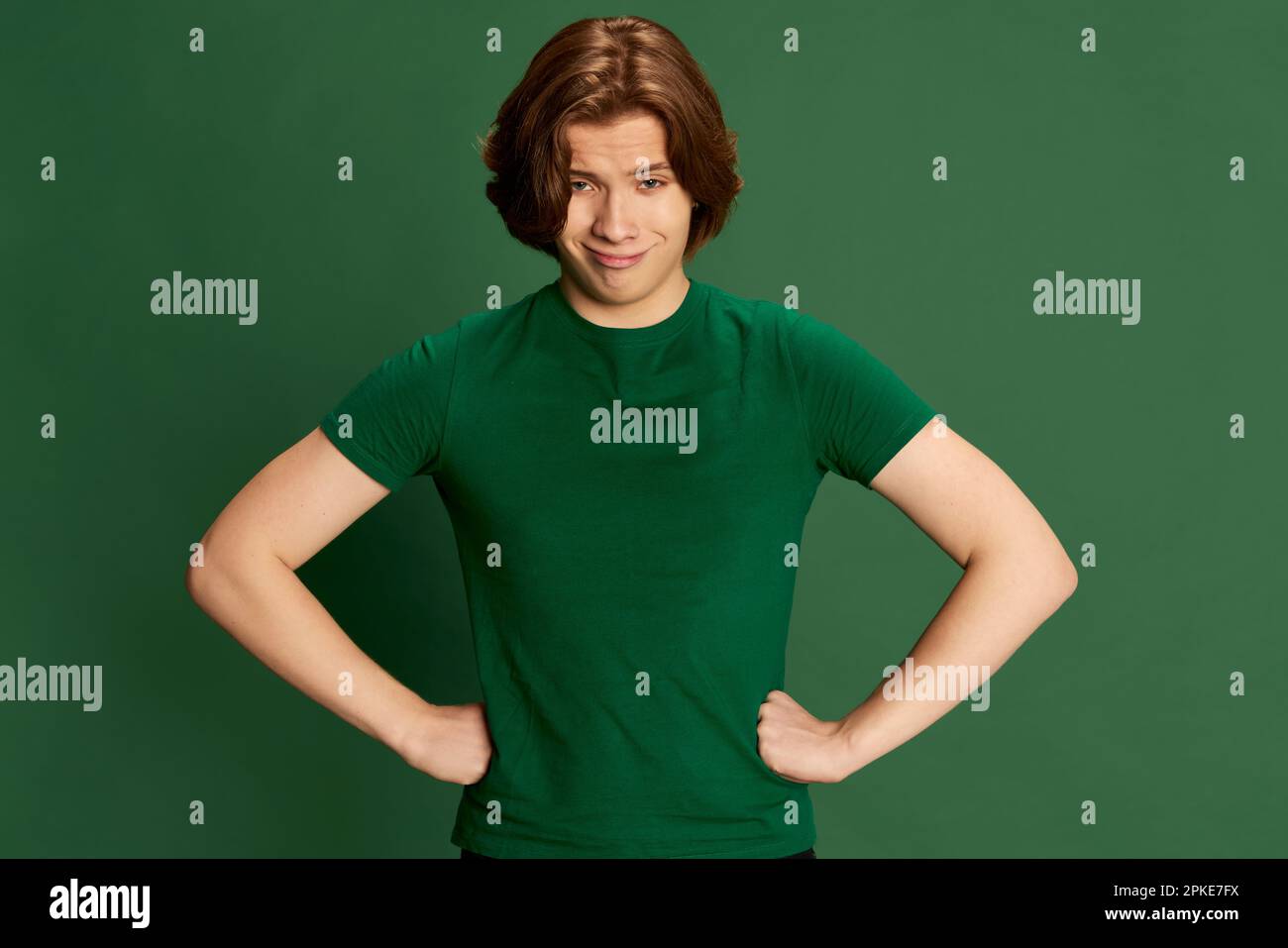 Young handsome boy, guy standing with hands on waist with confident ...