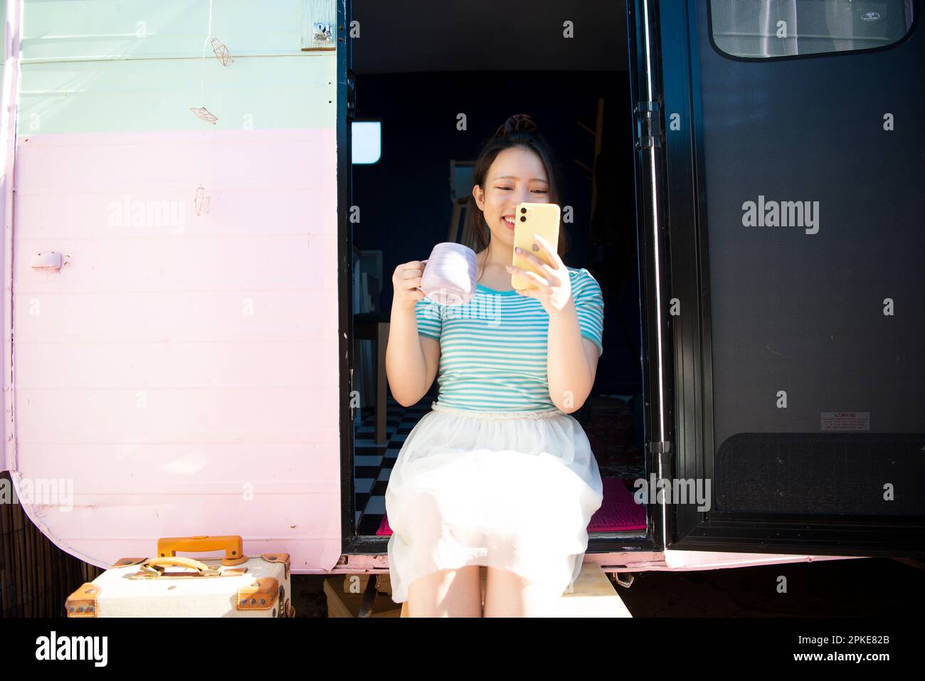 Mobile sitting hi-res stock photography and images - Alamy