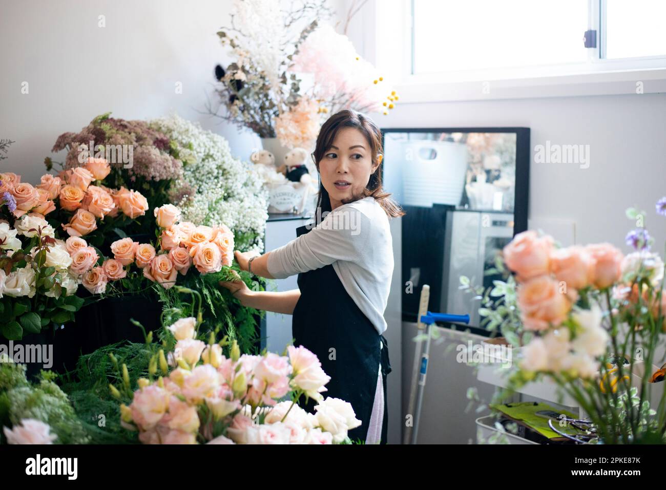 Serious asian female florist hi-res stock photography and images - Alamy