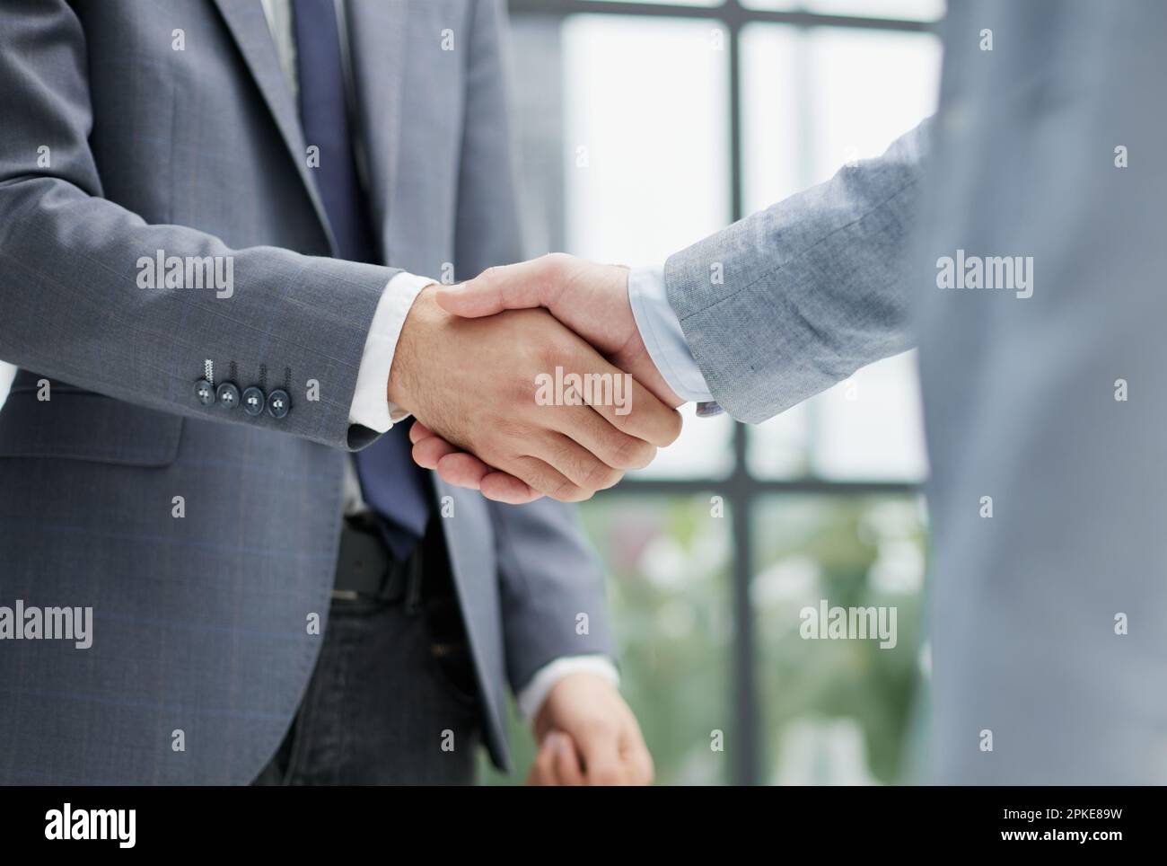 Two business men shaking hands together after successful meeting Stock ...