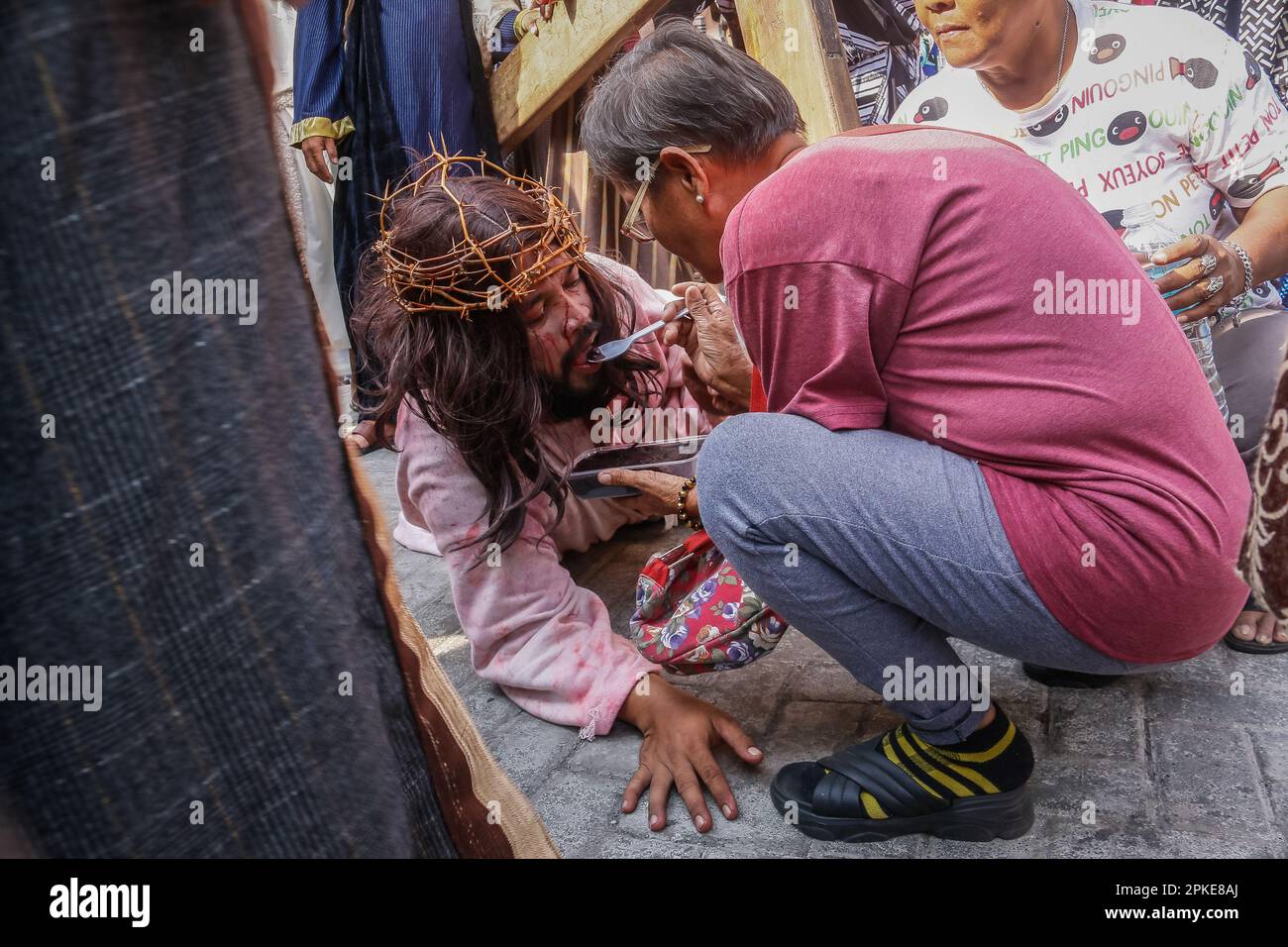 Antipolo, Philippines. 07th Apr, 2023. A Catholic faithful receives a ...