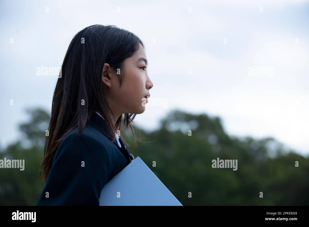 Female student in school uniform in profile Stock Photo - Alamy